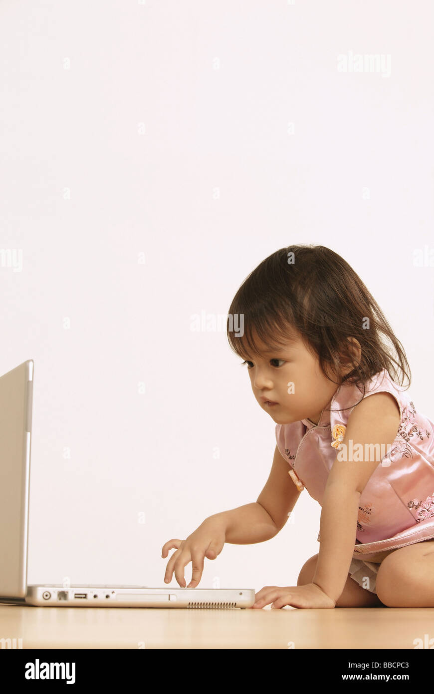 Young girl using laptop Stock Photo - Alamy