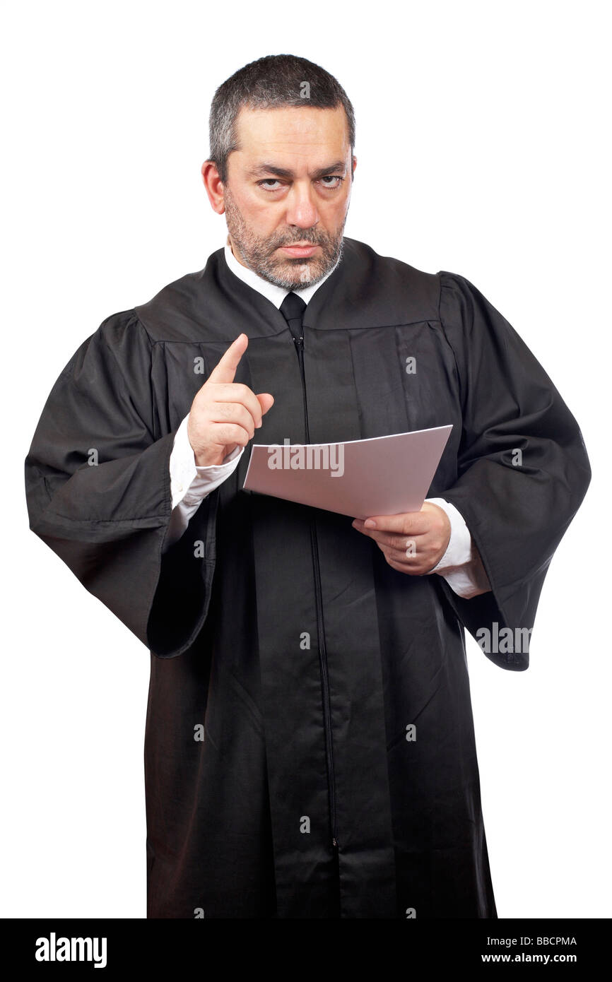 Serious male judge reading the sentence isolated on white background ...
