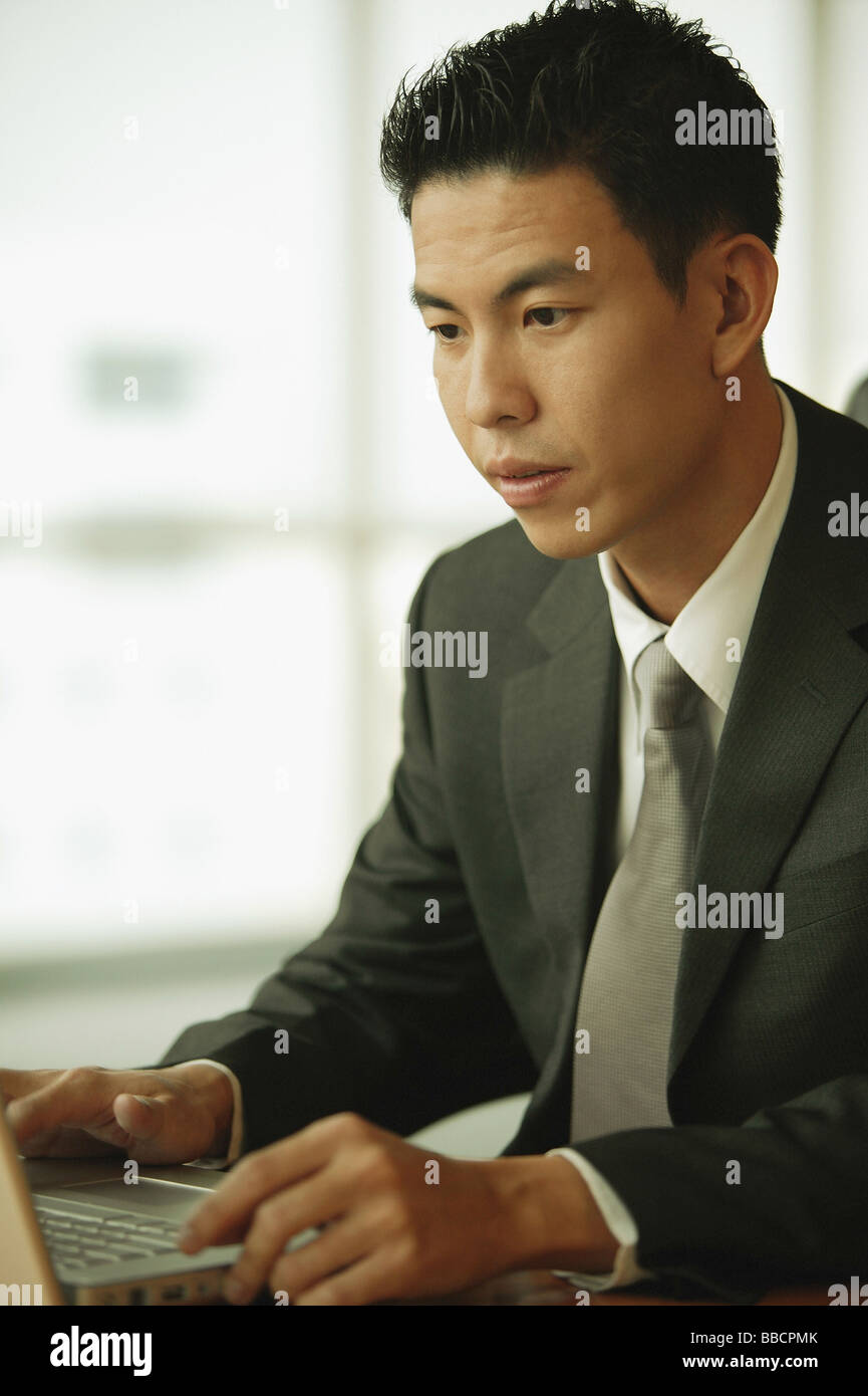Young asian business man laptop hi-res stock photography and images - Alamy