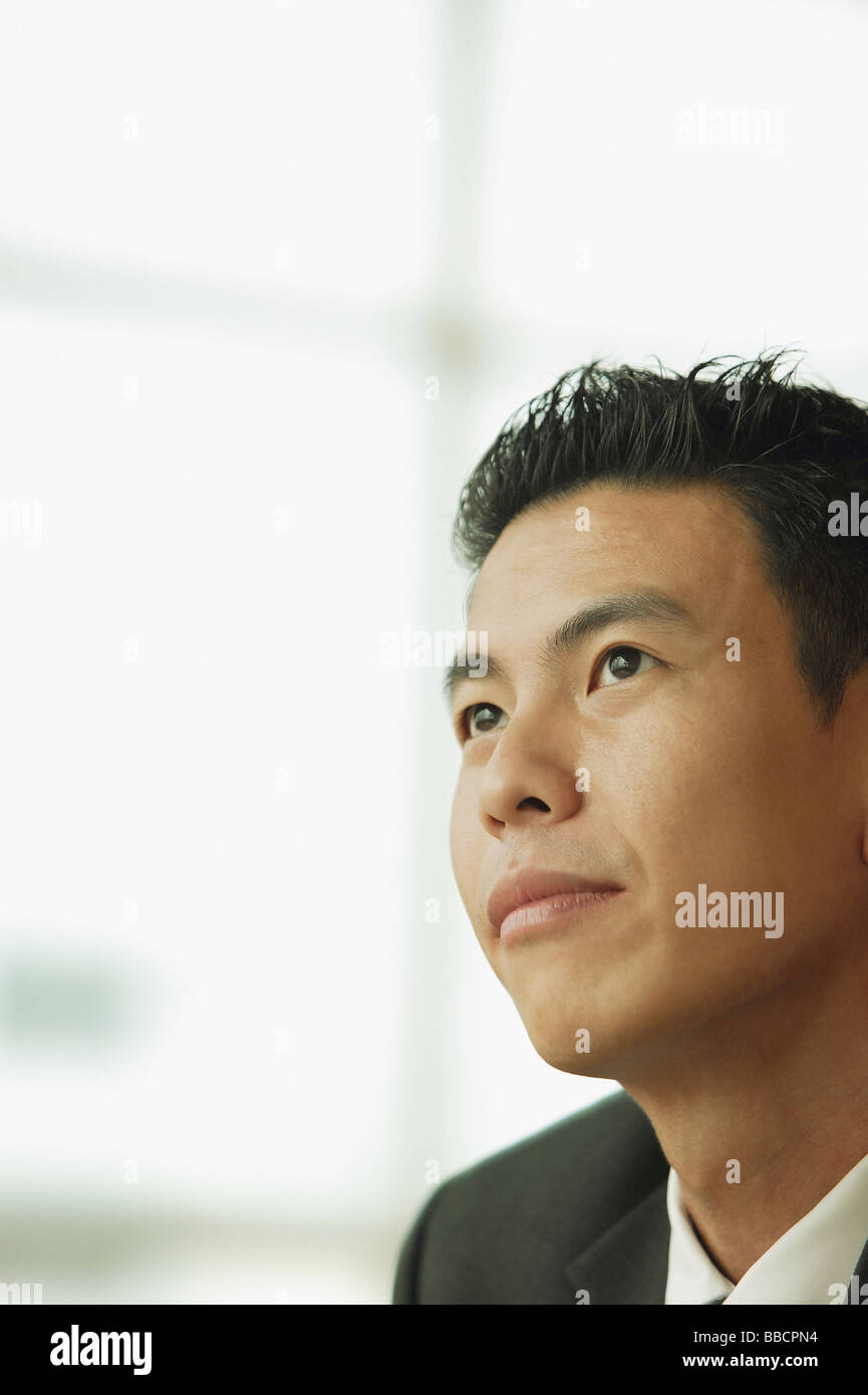 Young man looking up Stock Photo - Alamy