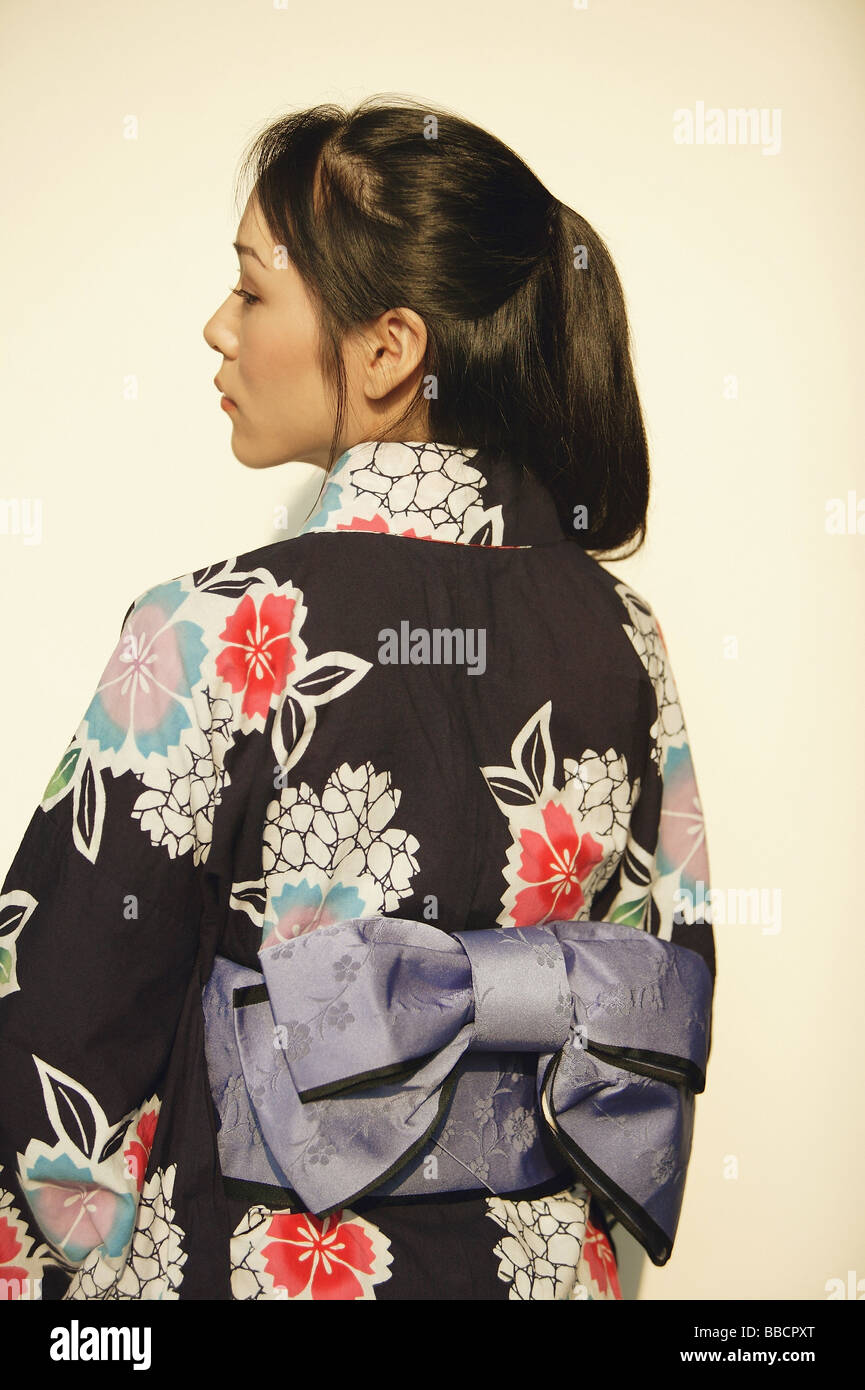 Young woman in kimono, rear view Stock Photo - Alamy