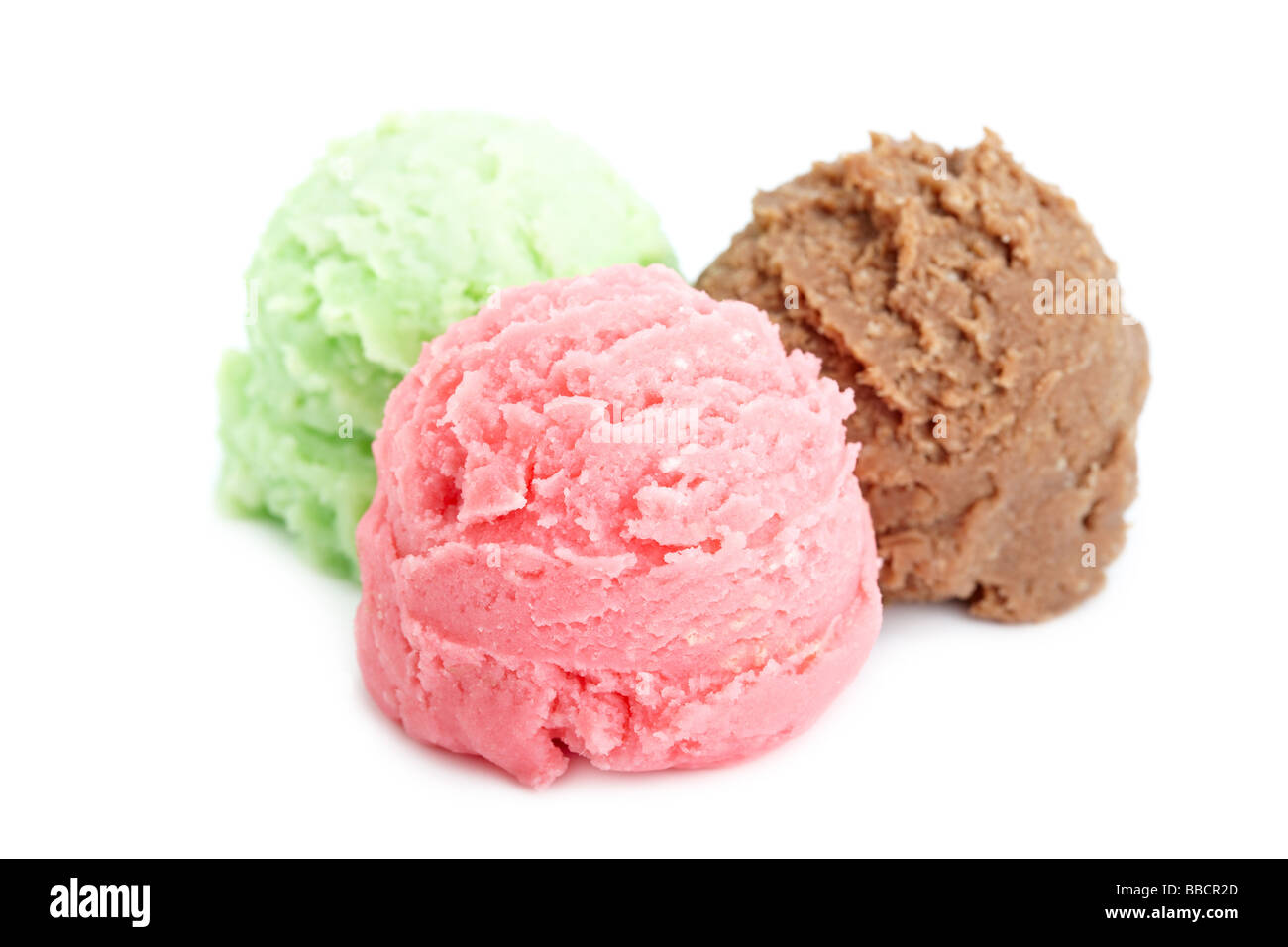 Three balls of multi flavor ice cream isolated on white background ...