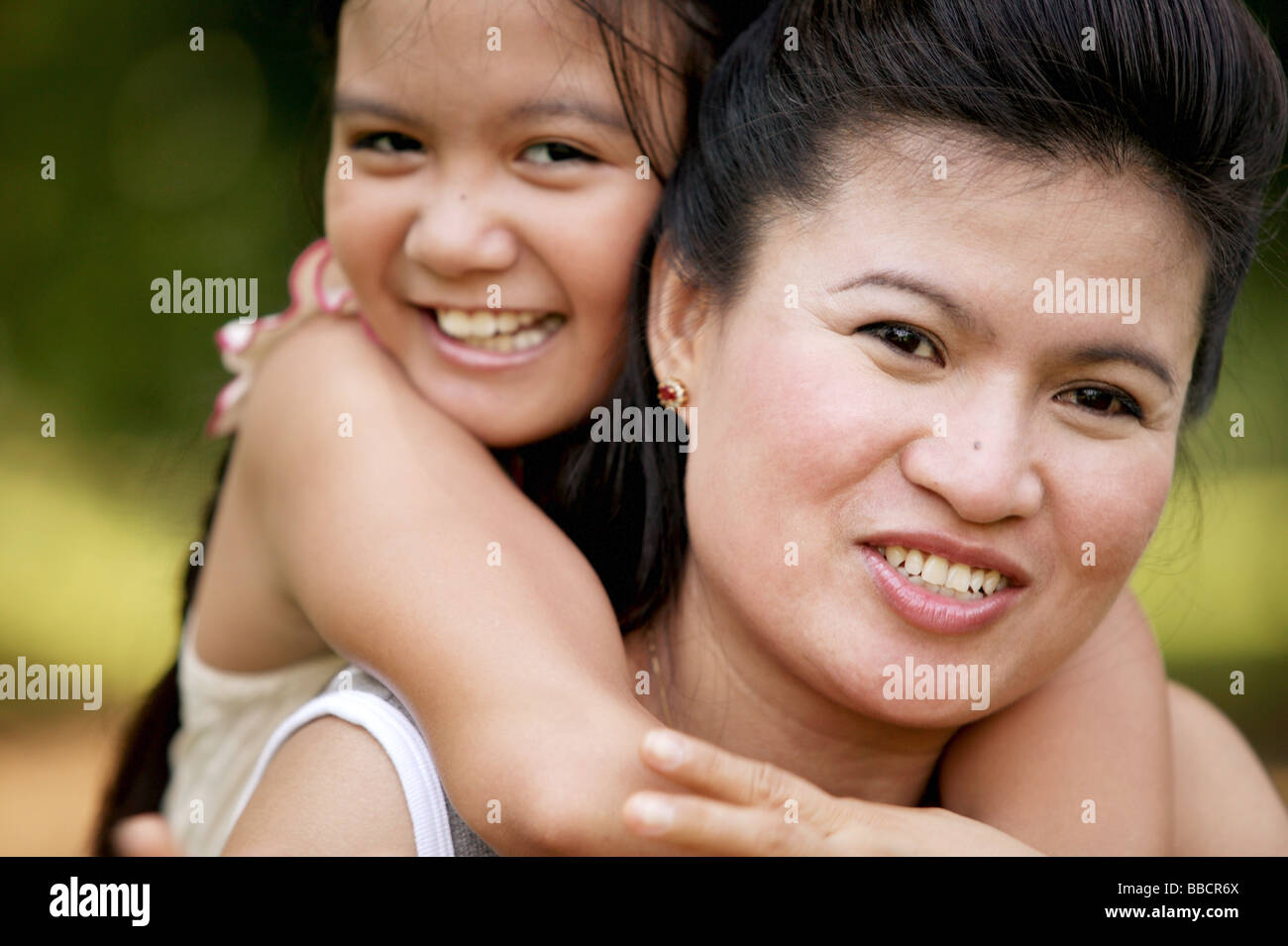 Filipino woman and daughter hi-res stock photography and images - Alamy