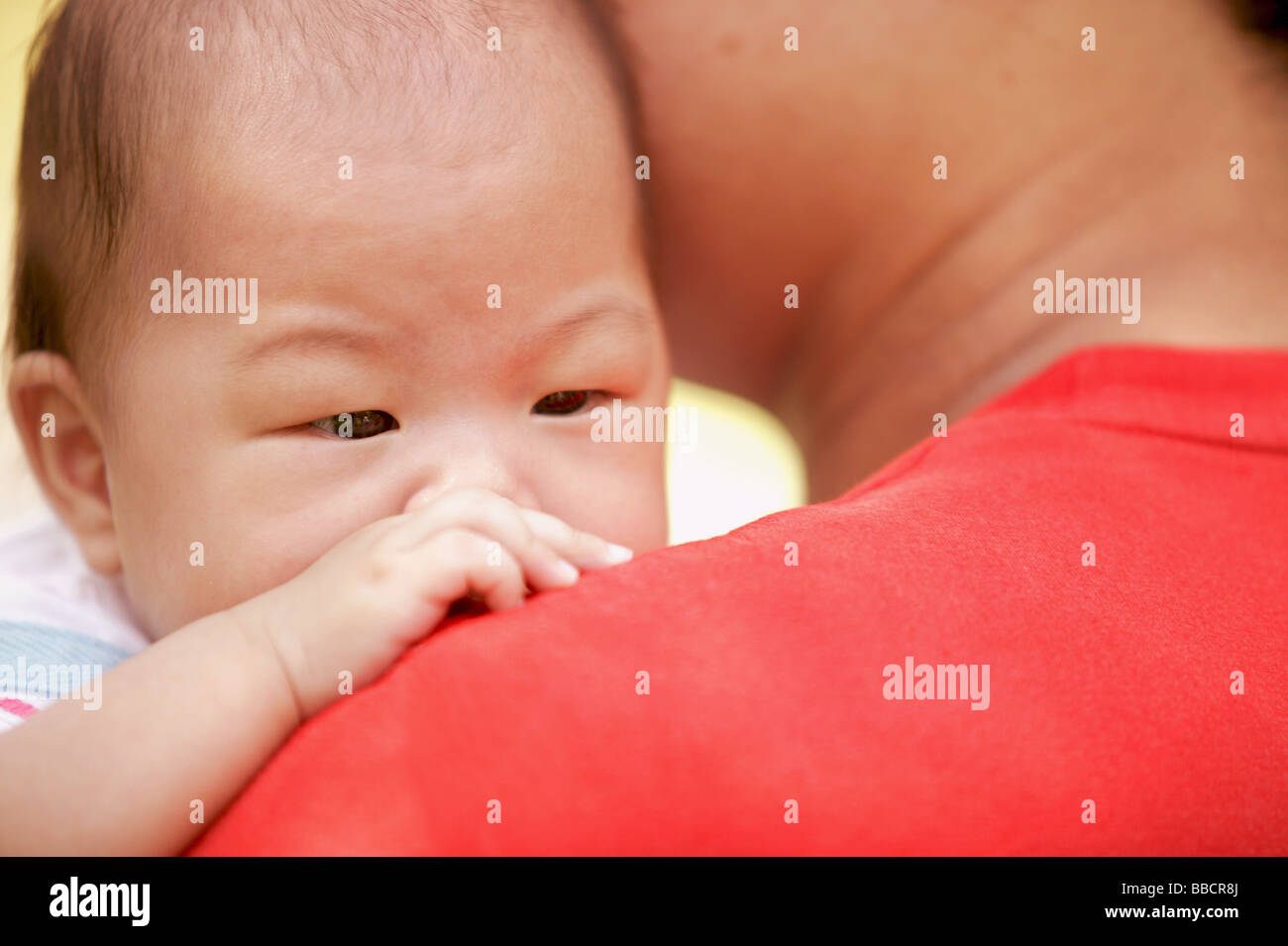 Baby being carried by father Stock Photo - Alamy
