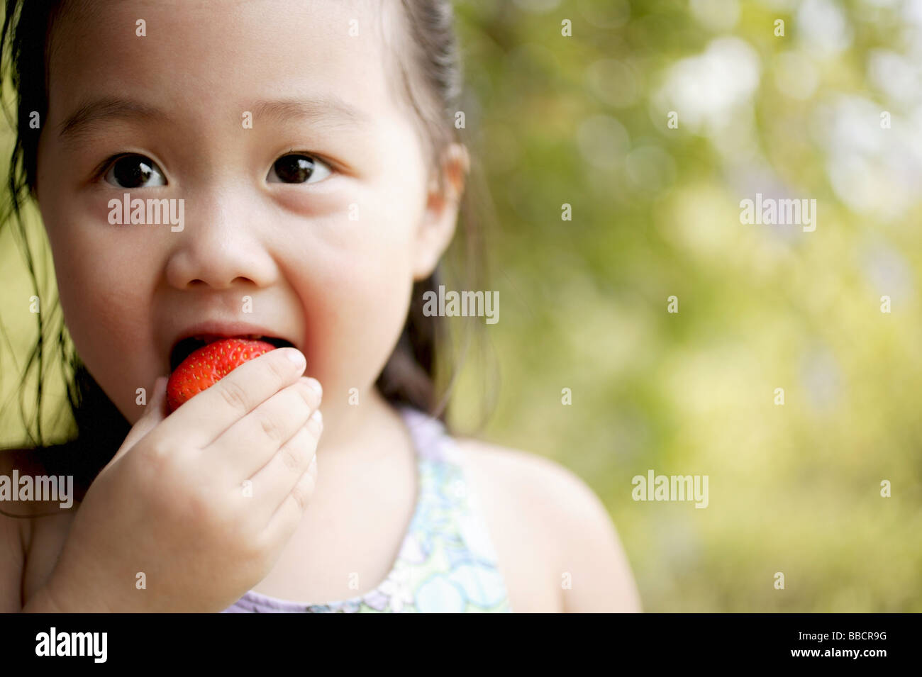 Young girl eating, portrait Stock Photo - Alamy