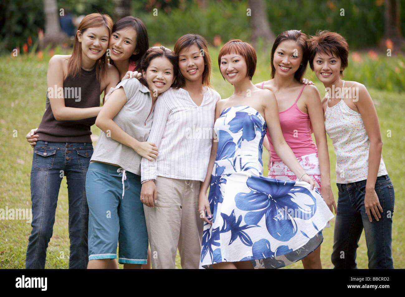 Group of young women posing for camera Stock Photo - Alamy
