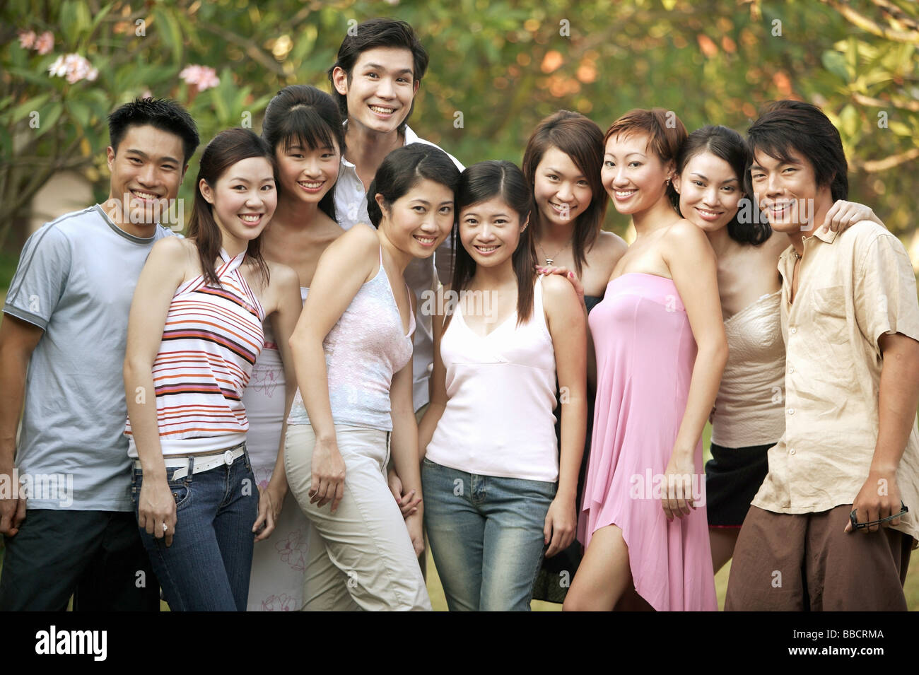 Group of friends looking at camera, smiling Stock Photo - Alamy
