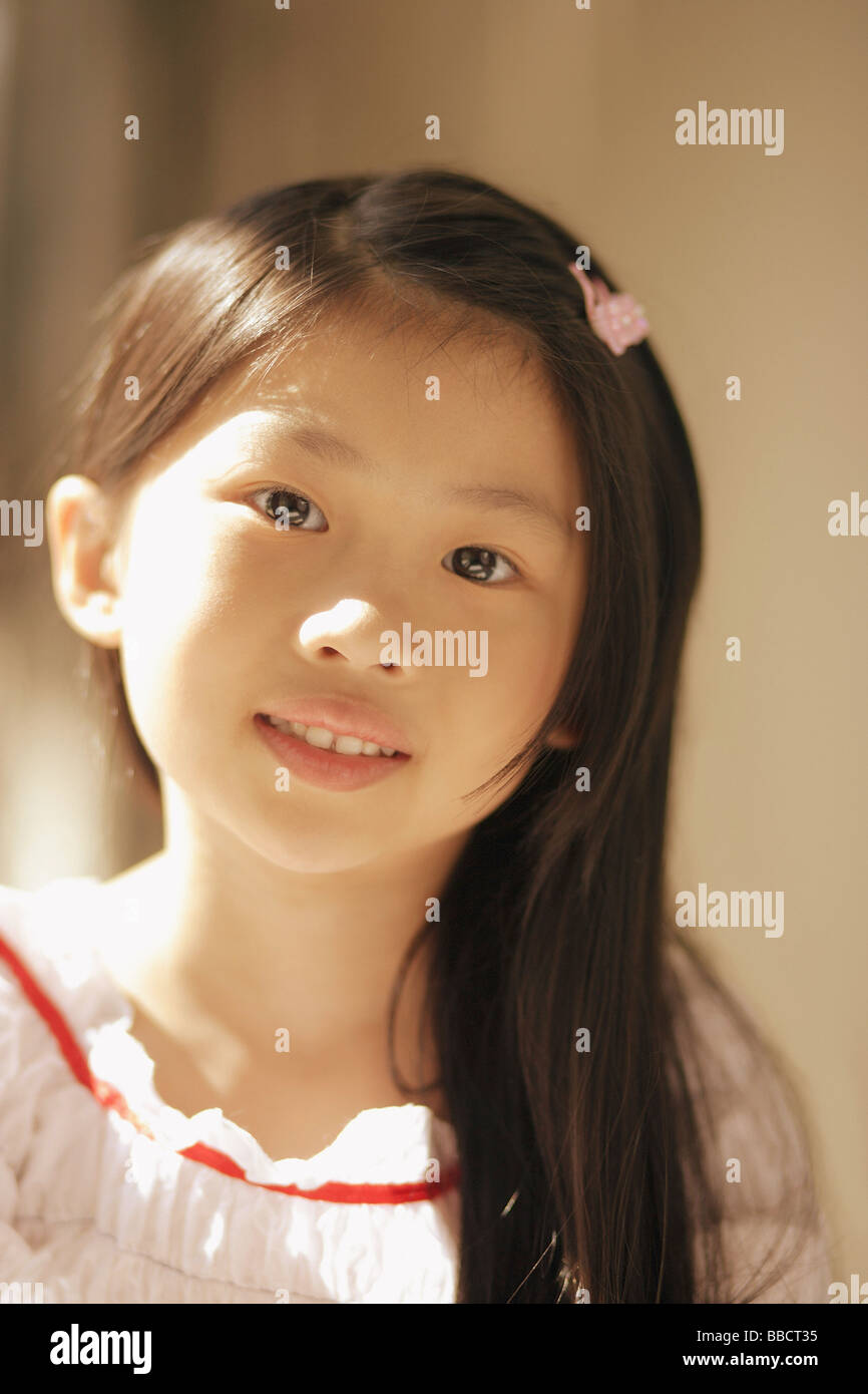 Young girl looking at camera Stock Photo - Alamy