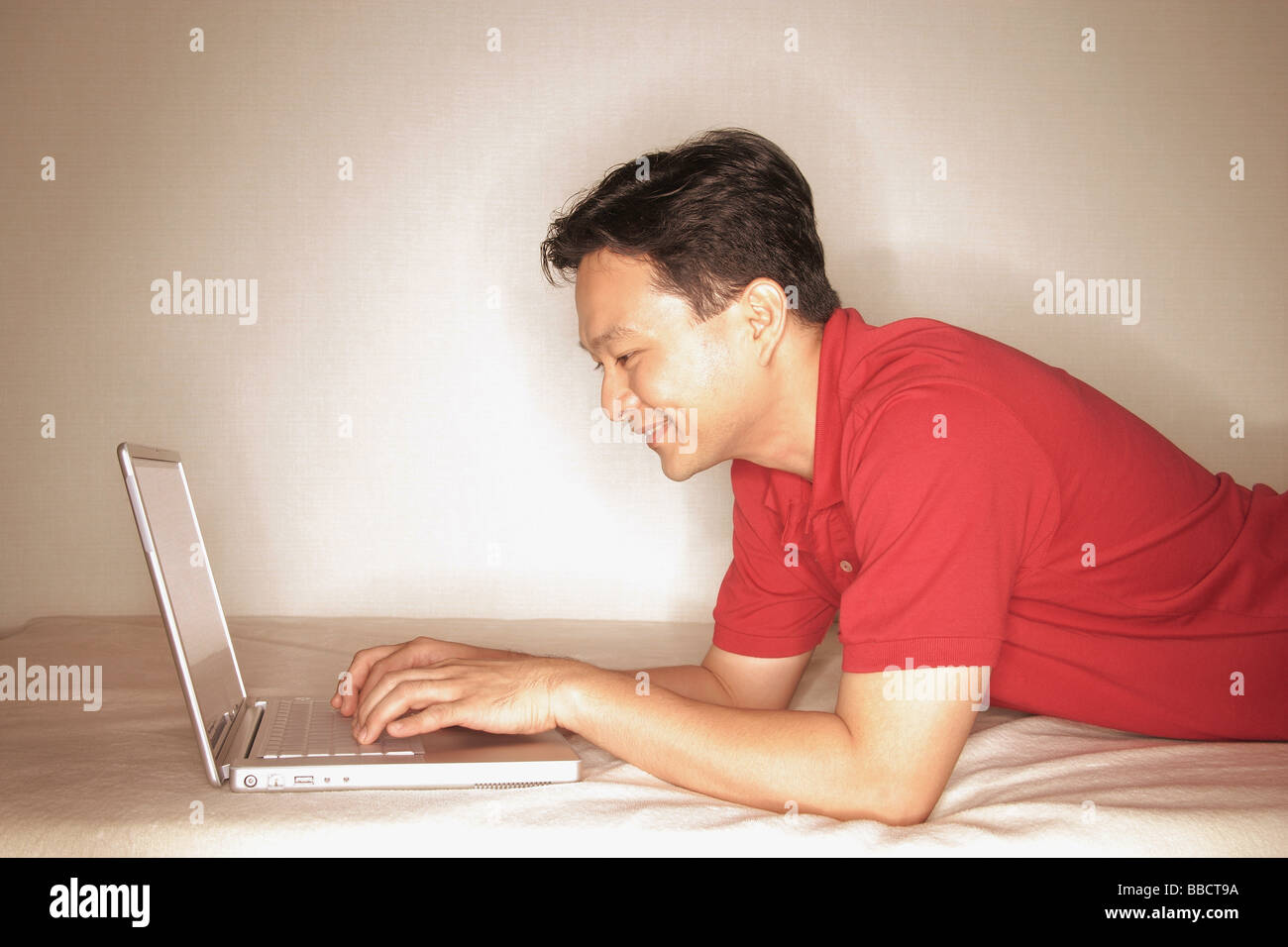 Man using laptop, profile Stock Photo - Alamy