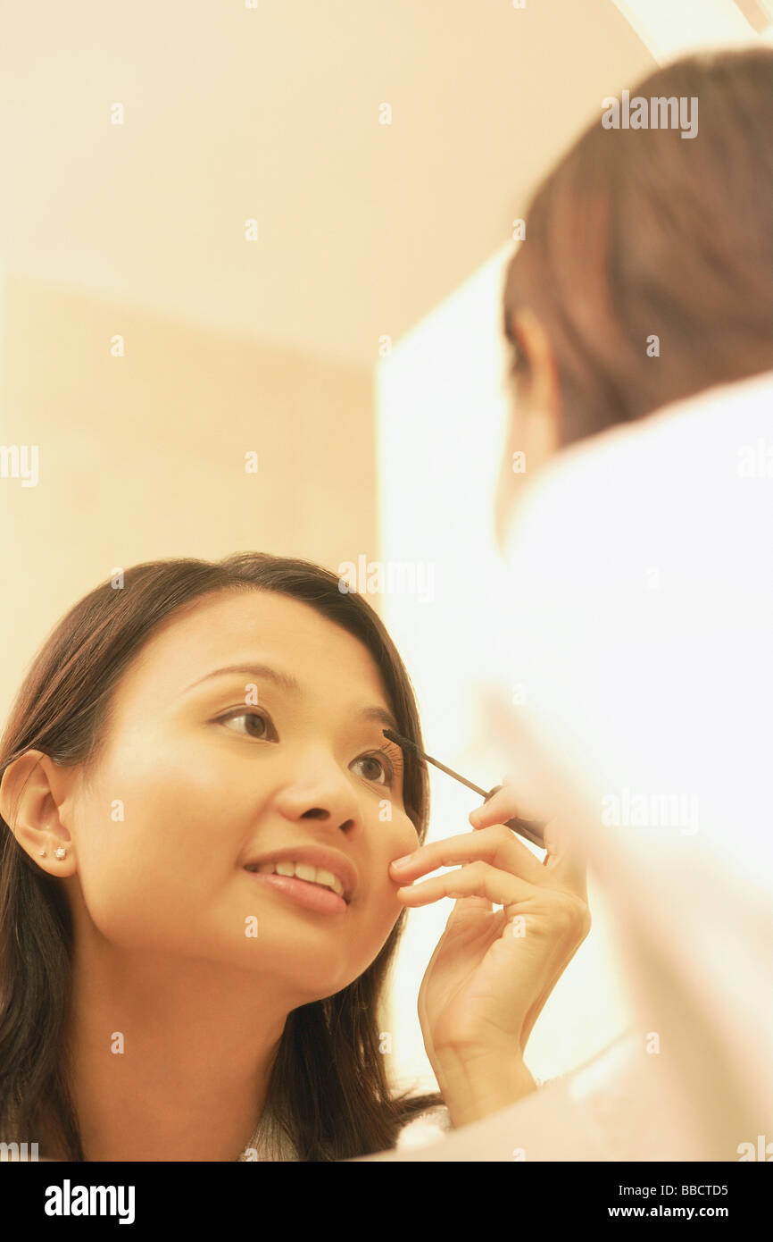 Chinese woman putting mascara on hi-res stock photography and images - Alamy