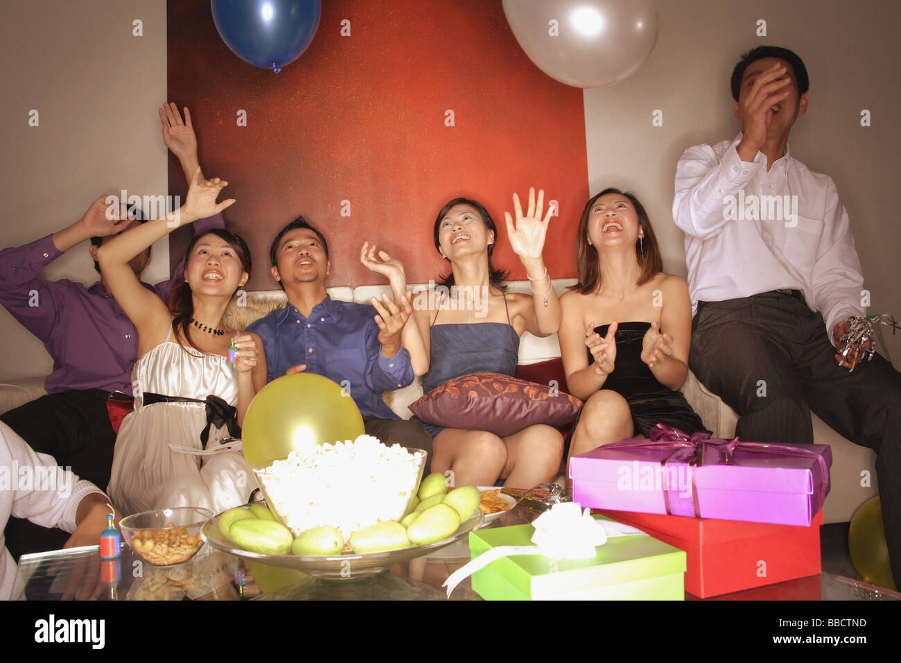 Group of friends having a party at home Stock Photo - Alamy
