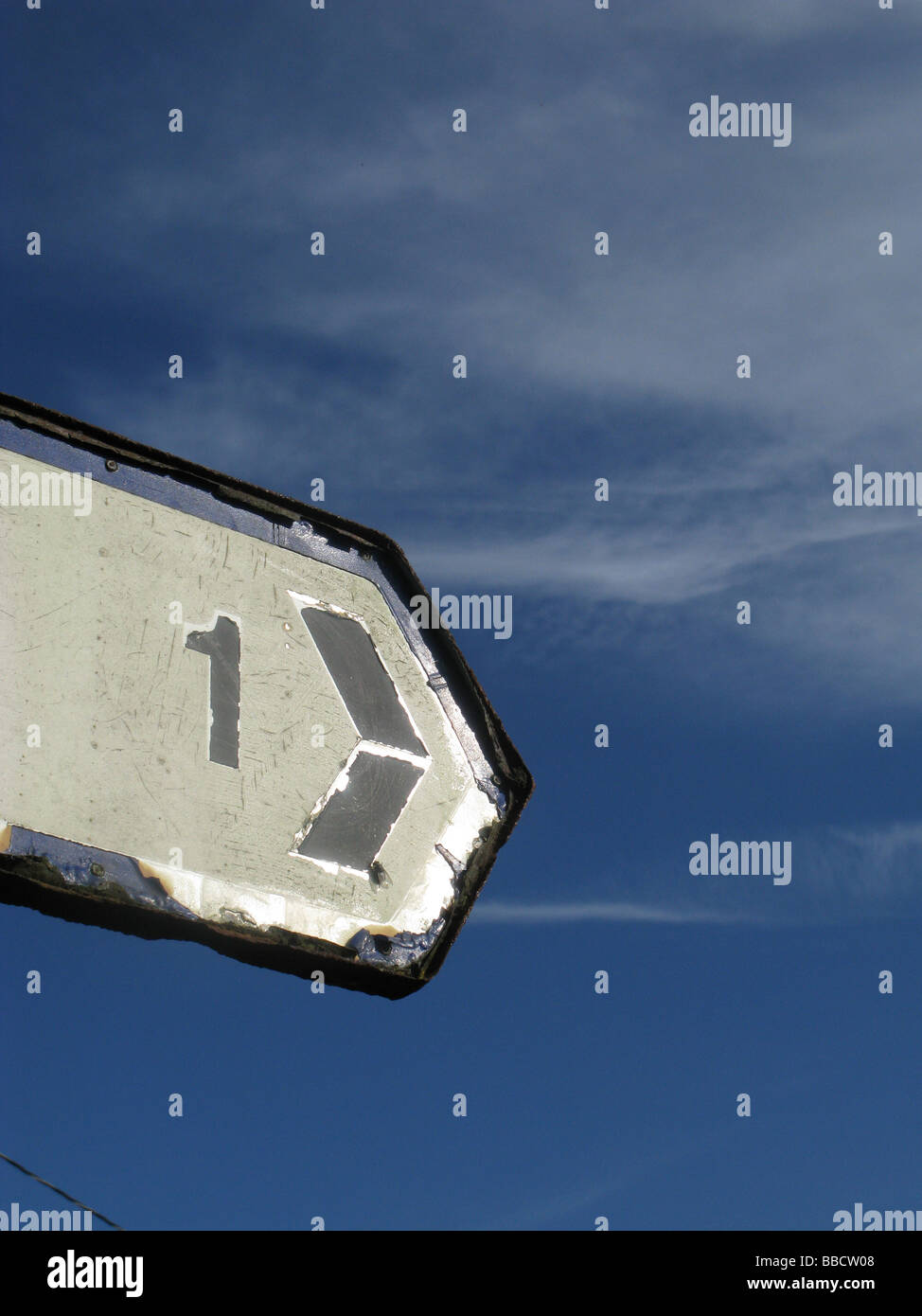 one old dirty road sign with one mile shown Stock Photo - Alamy