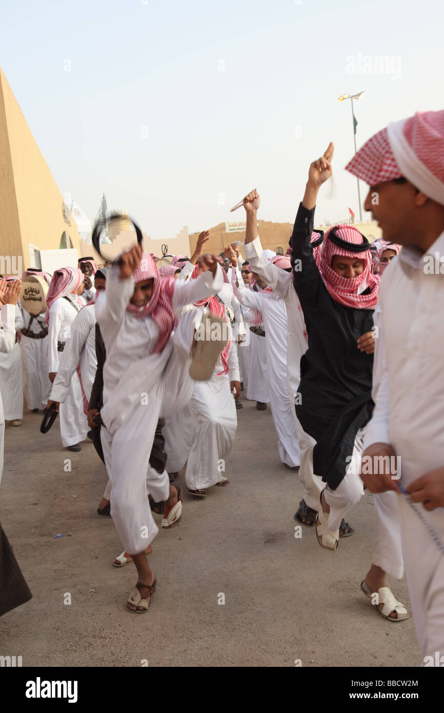 Men dance in traditional dress Janadriya Festival Riyadh Saudi Arabia ...