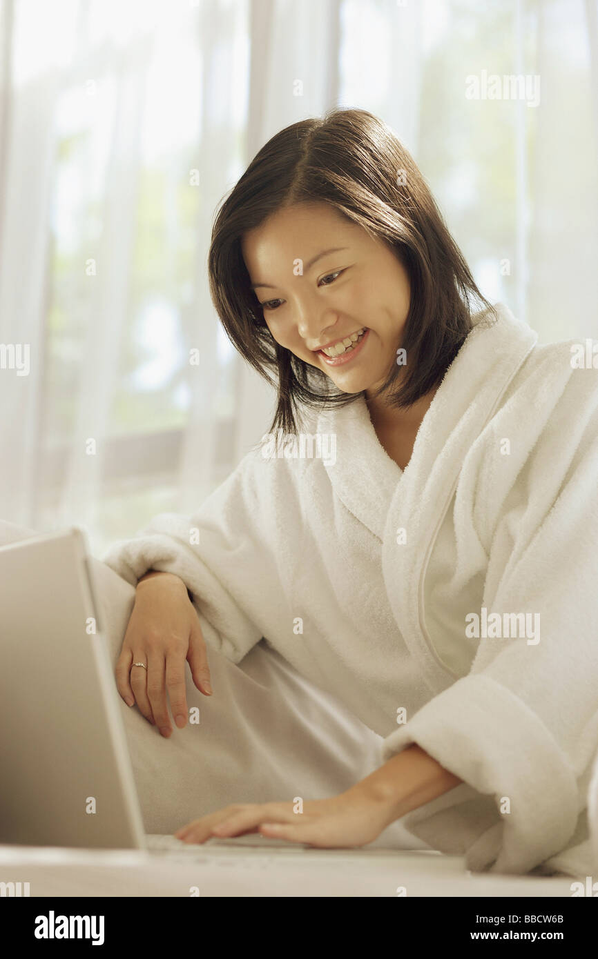Woman wearing white robe working hi-res stock photography and images ...