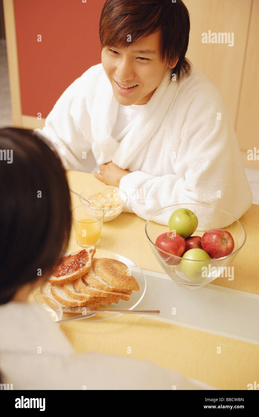 Couple sitting across breakfast table hi-res stock photography and ...