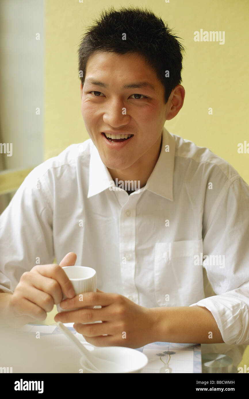 Young man in restaurant, portrait Stock Photo - Alamy