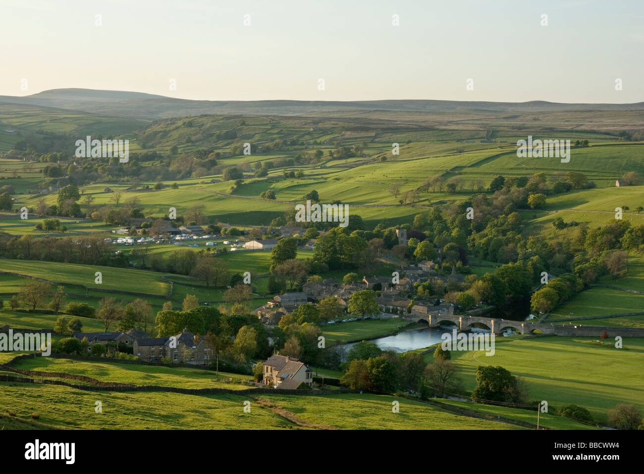 A view of the rolling valley and village of Burnsall, in Wharfedale ...