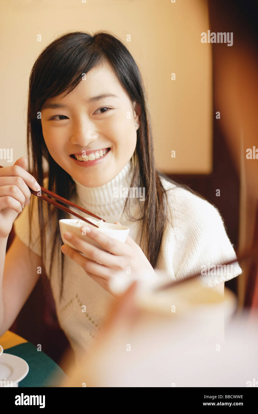 Young women at a Chinese restaurant, eating Stock Photo - Alamy