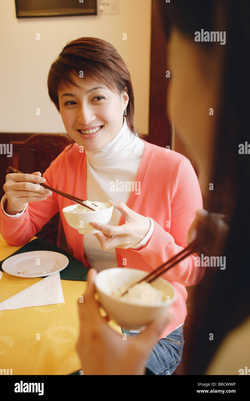 Young women eating at a Chinese restaurant Stock Photo - Alamy