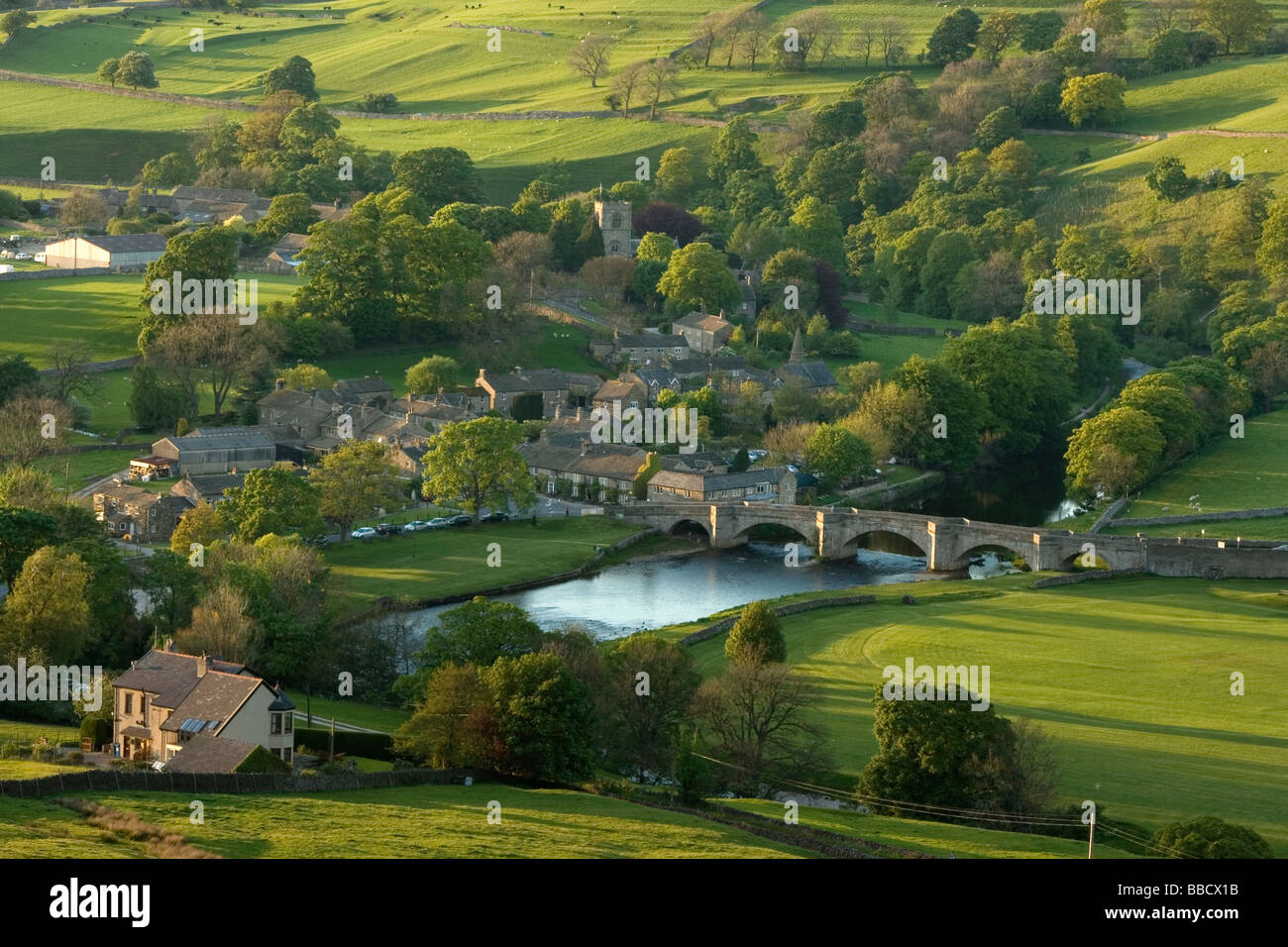 A view of the bridge and River Wharfe at the village of Burnsall, in ...