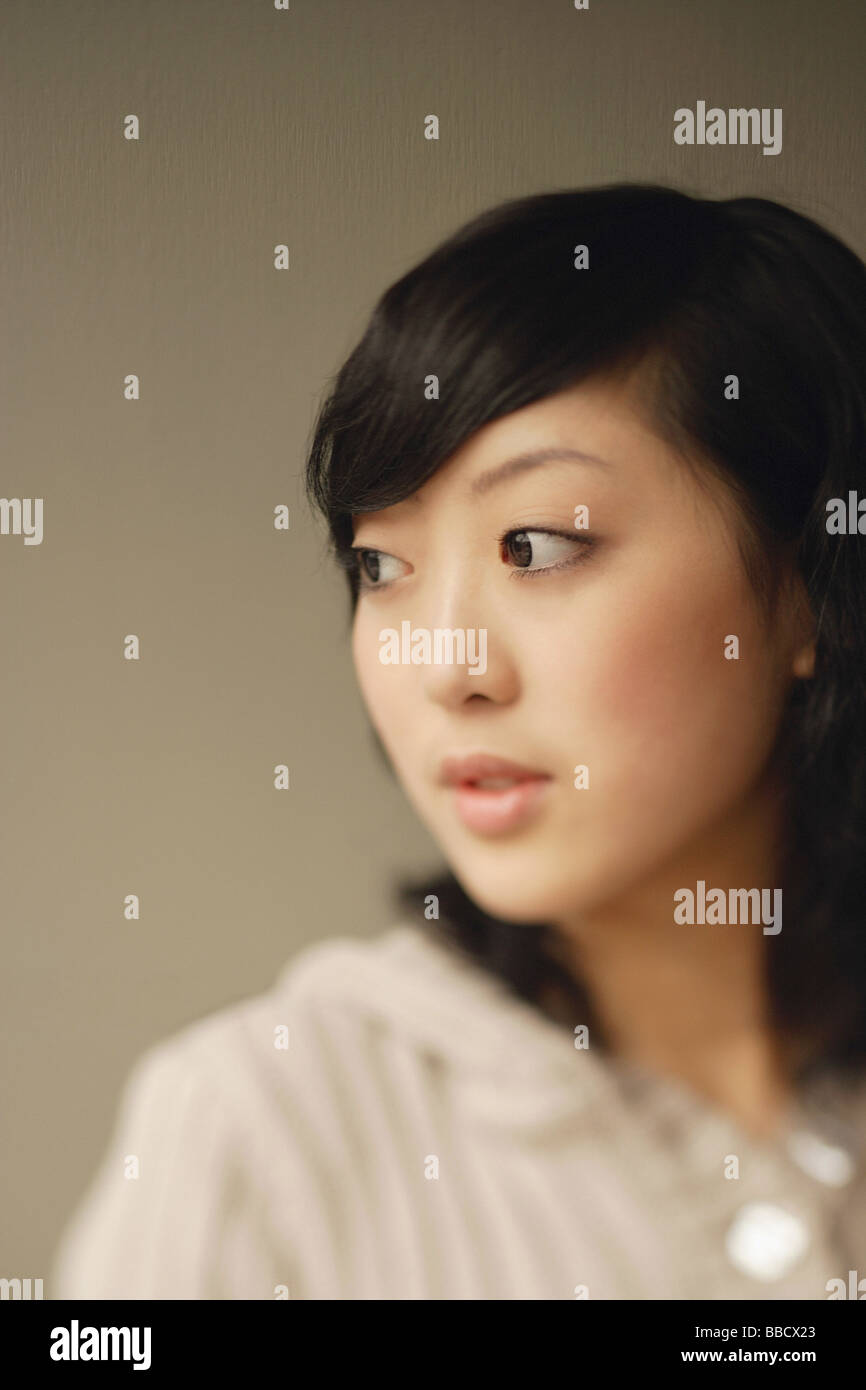 Young woman, looking away Stock Photo - Alamy