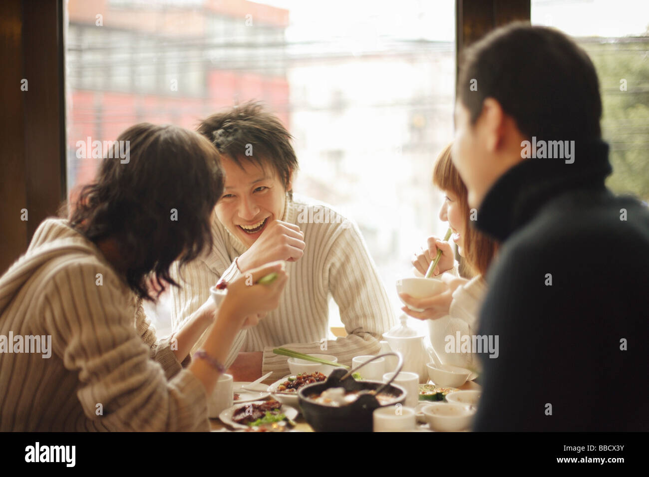 Group of friends at a Chinese restaurant Stock Photo - Alamy