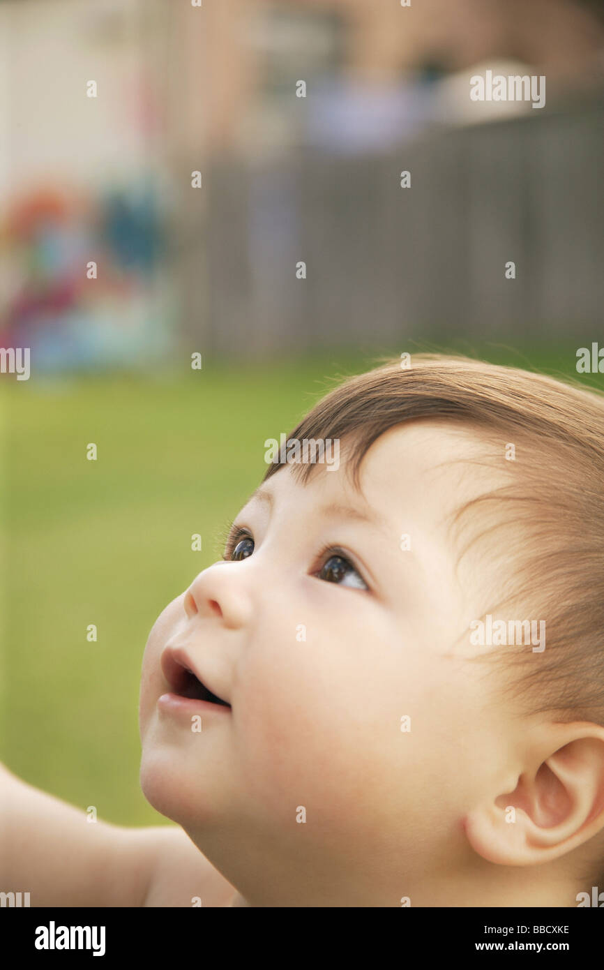 Baby girl, looking up Stock Photo - Alamy