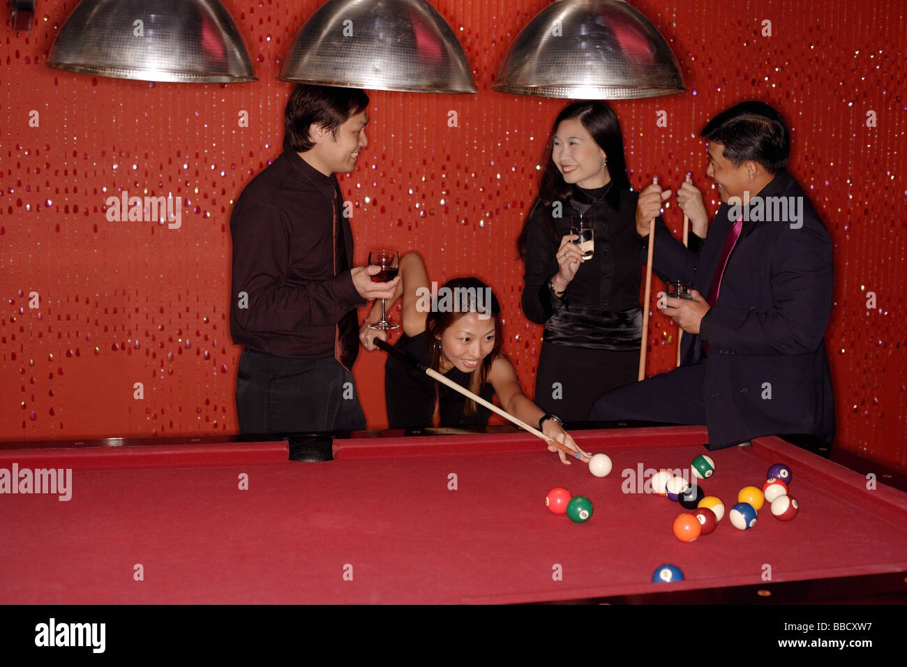 Couples playing pool Stock Photo - Alamy