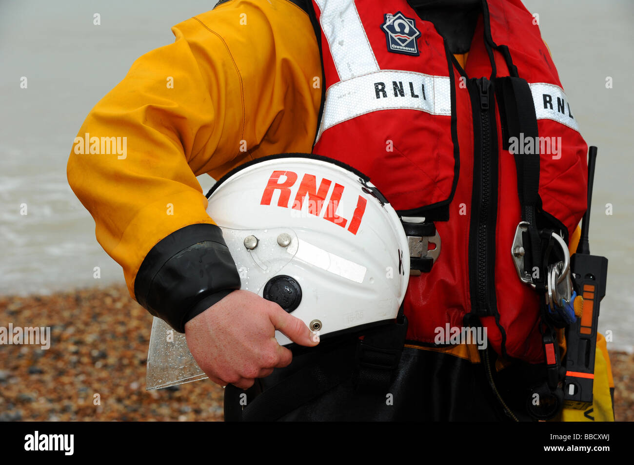 A member of the RNLI on the beach Stock Photo - Alamy