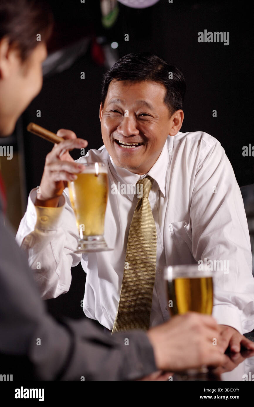 Two men drinking beer Stock Photo - Alamy