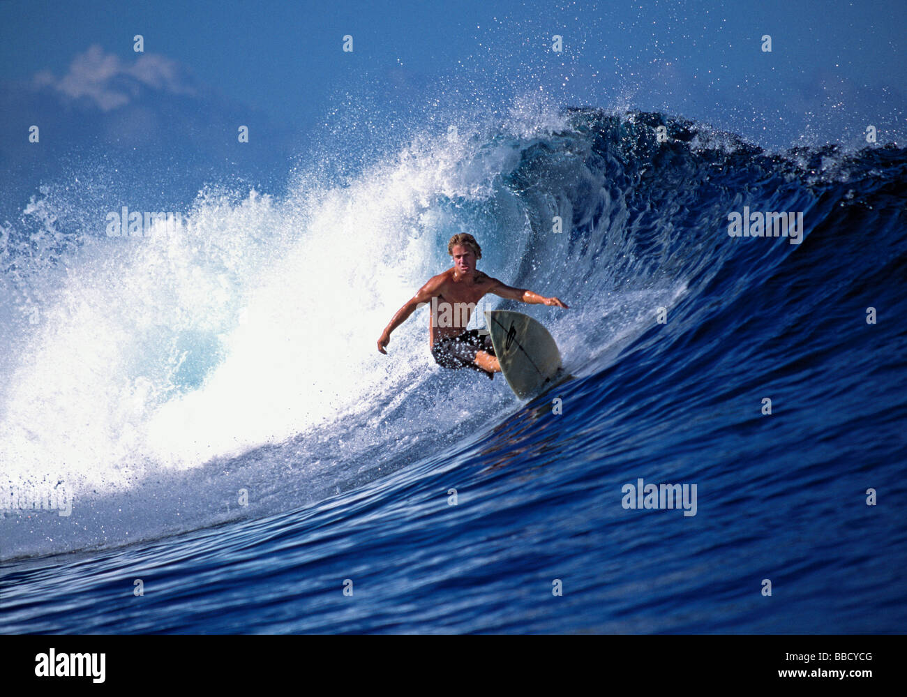 A surfer pulls out of a mammoth wave at Cloudbreak, Tavarua, Fiji ...