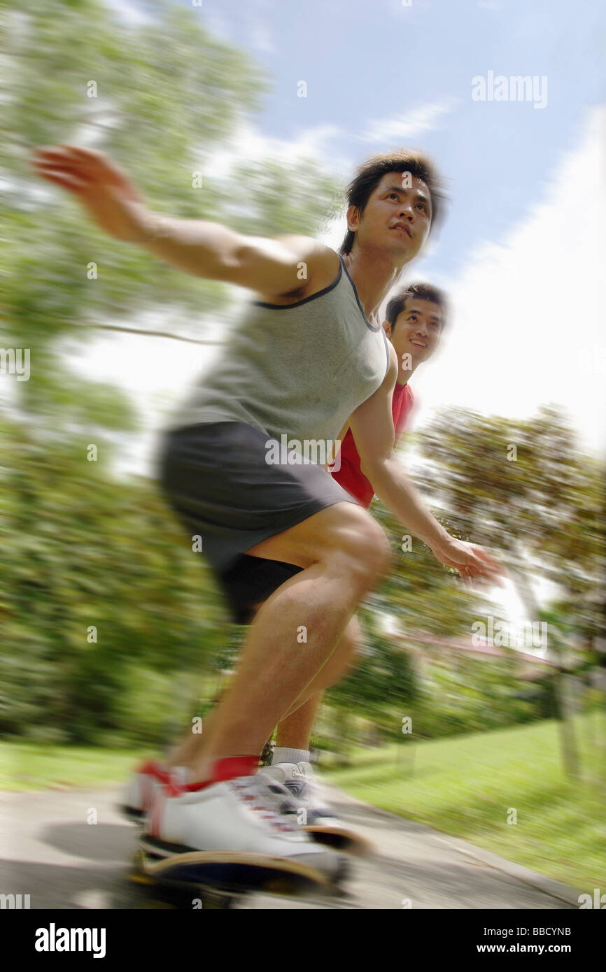 Two guys on skateboards Stock Photo - Alamy
