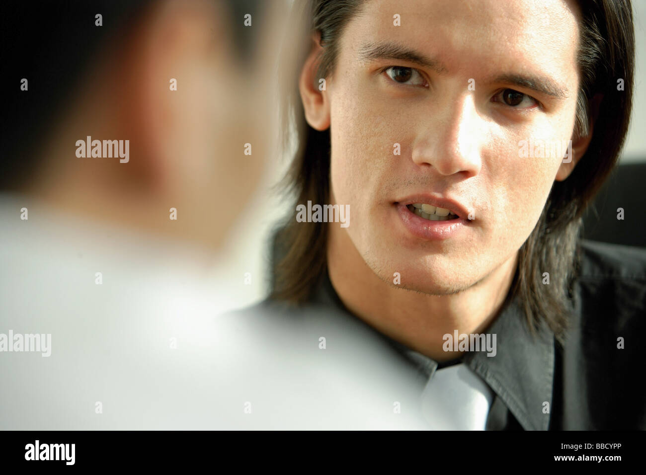 Two men talking, face to face Stock Photo - Alamy