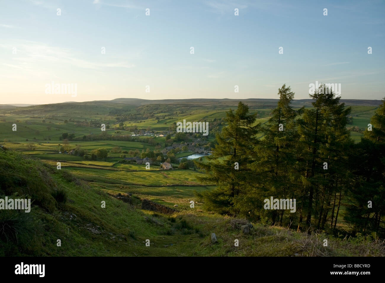 A view of the rolling valley and village of Burnsall, in Wharfedale ...