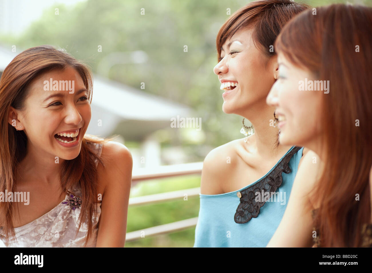 Three young women, smiling Stock Photo - Alamy