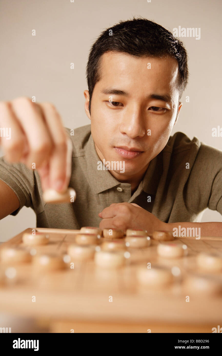 Man concentrating looking at chess board hi-res stock photography and ...