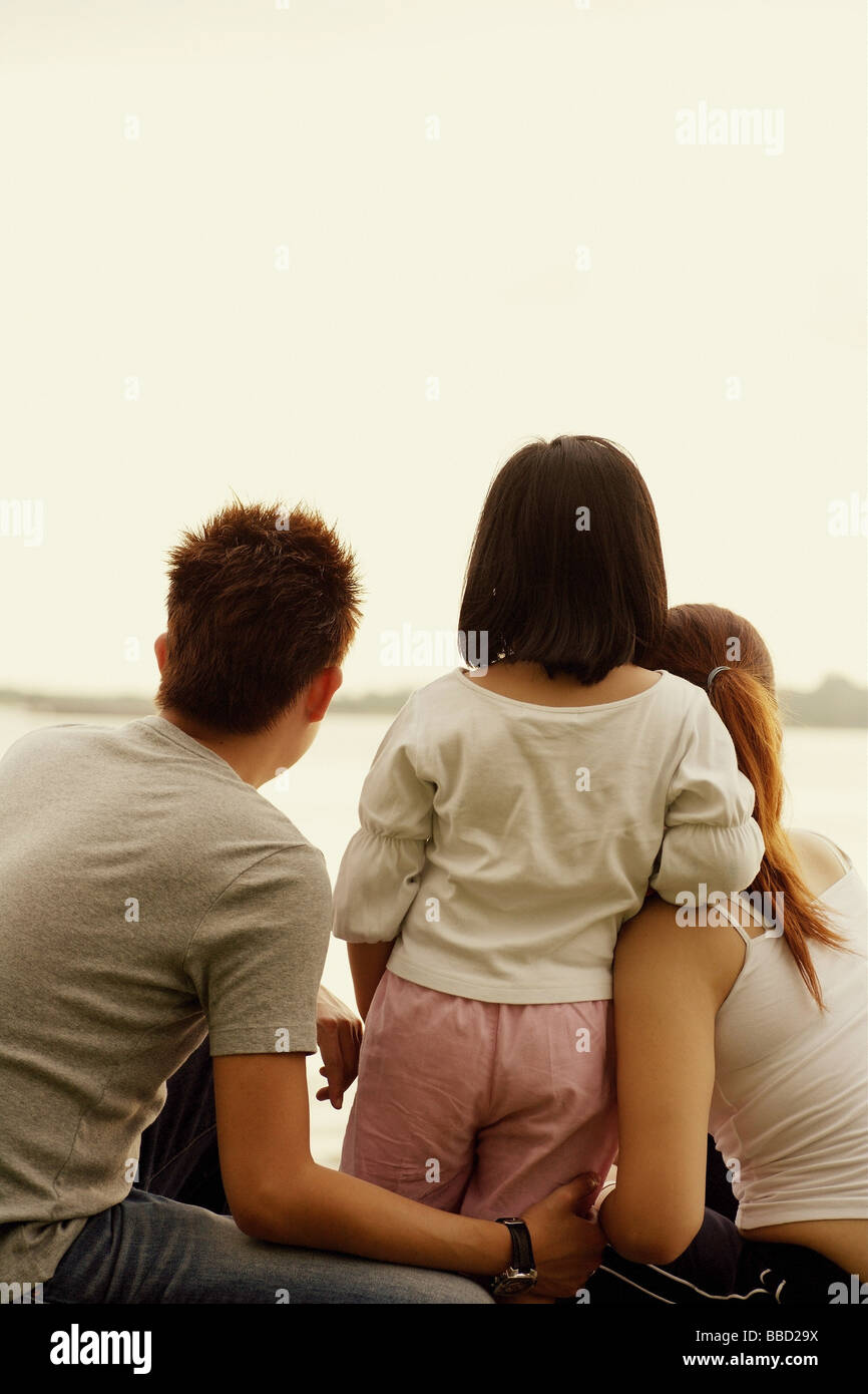 Family with one child, rear view Stock Photo - Alamy