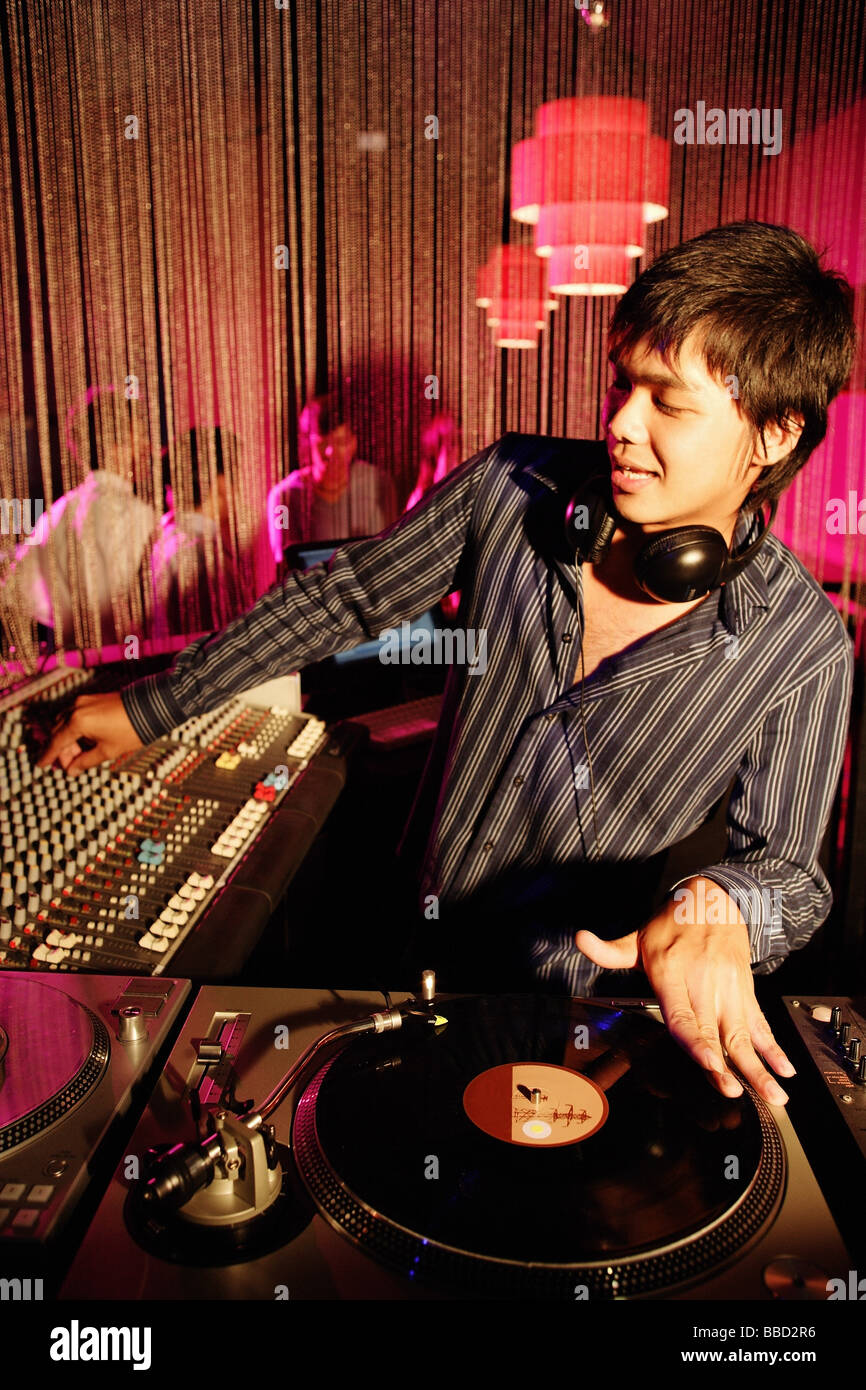 Young man spinning at club Stock Photo - Alamy