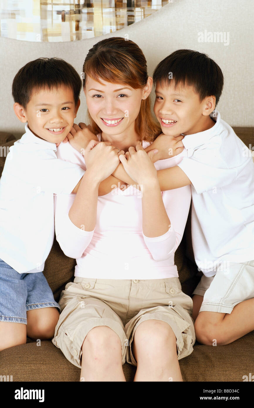 Mother with two children Stock Photo - Alamy