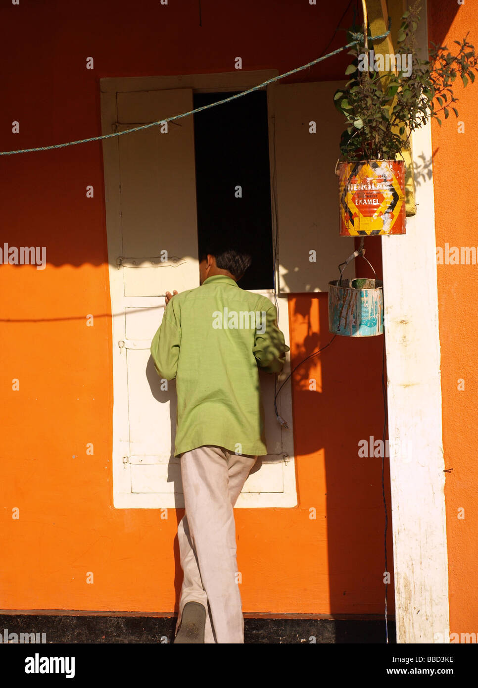 Village boy peeping inside house, Trimbakeshwar, India Stock Photo - Alamy