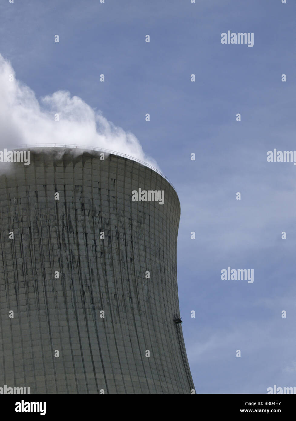 Close up of nuclear power plants cooling stack with smoke rising from ...