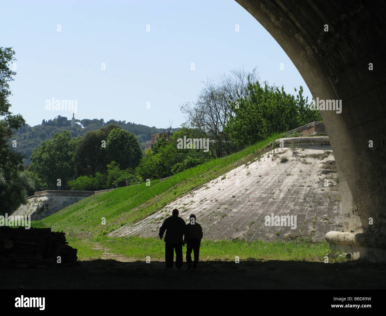 Silhouette man walking under bridge hi-res stock photography and images ...