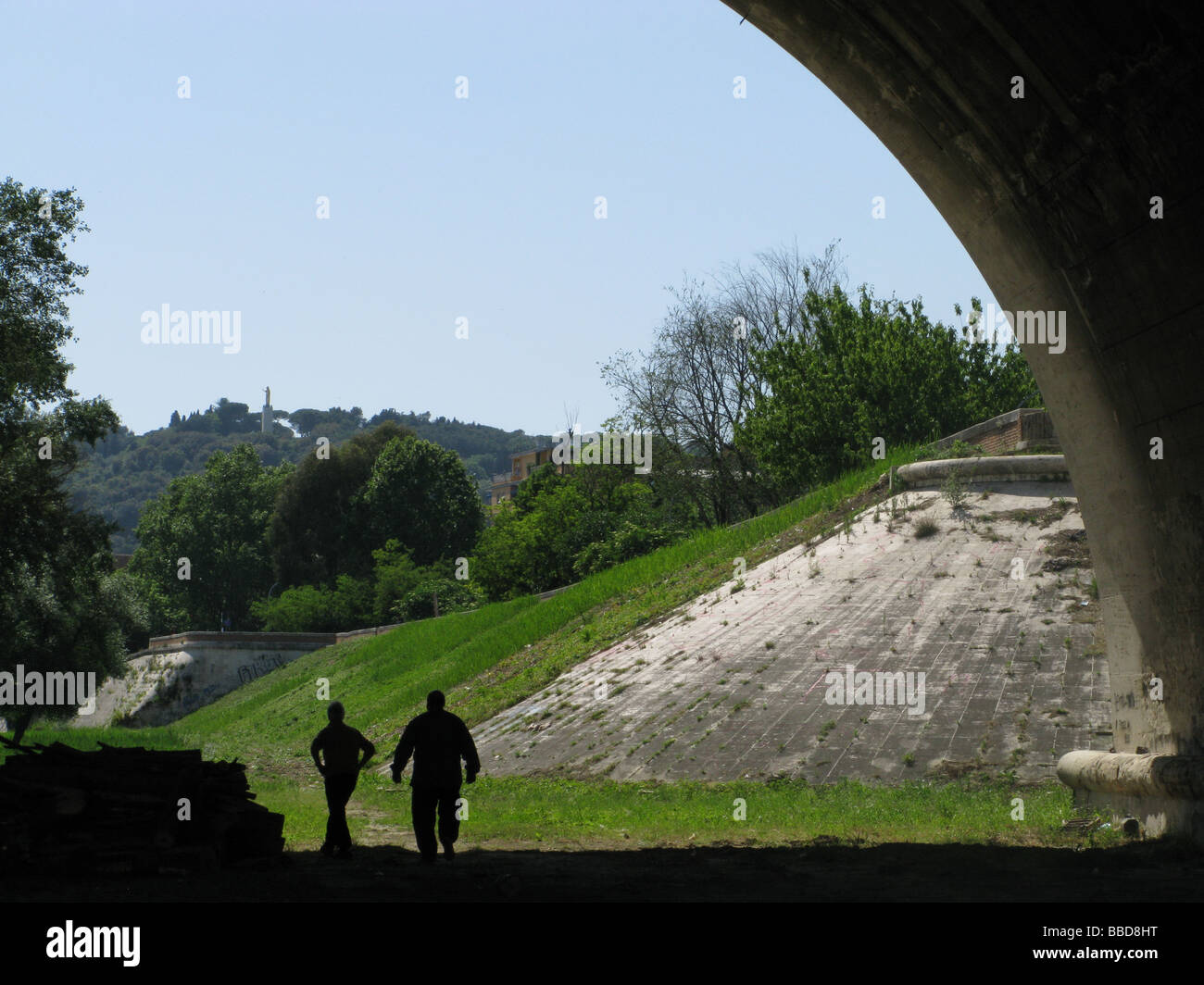 Silhouette man walking under bridge hi-res stock photography and images ...