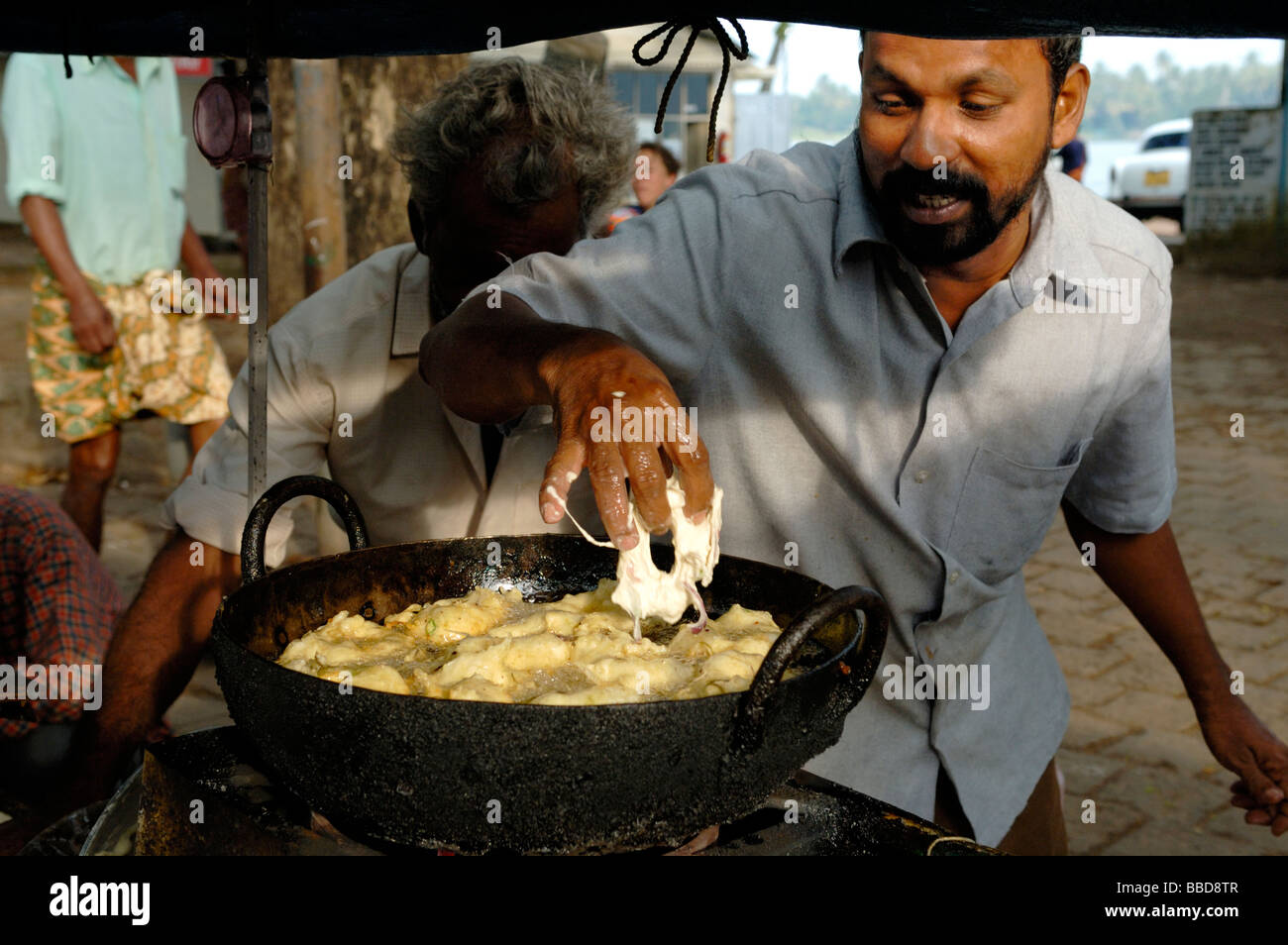 India, Kerala, Fort Cochin. Indian street cook preparing tea and ...