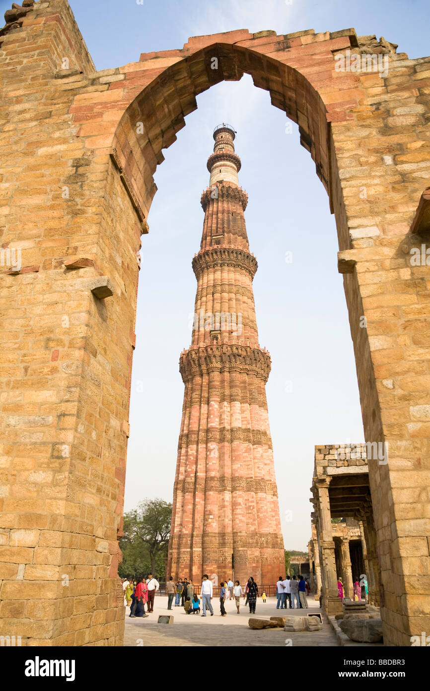 The Qutb Minar minaret, viewed through an arch, in the Qutb Minar ...