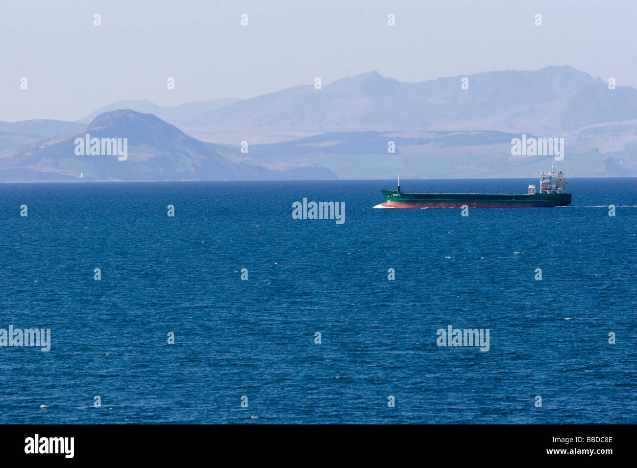 Container ship passing the Isle of Arran in the forth of clyde on the ...