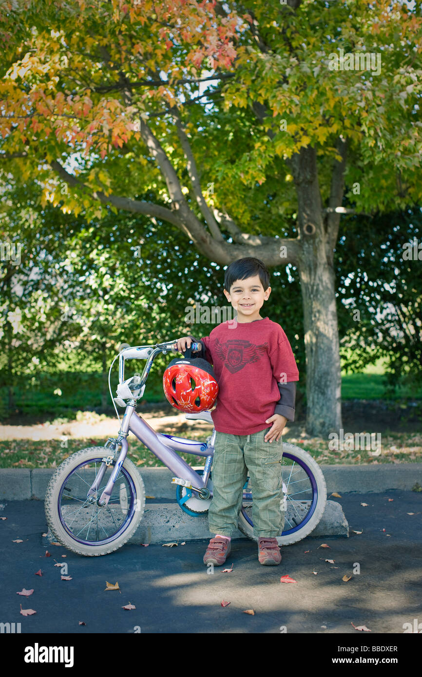 Boy standing bicycle side view hi-res stock photography and images - Alamy