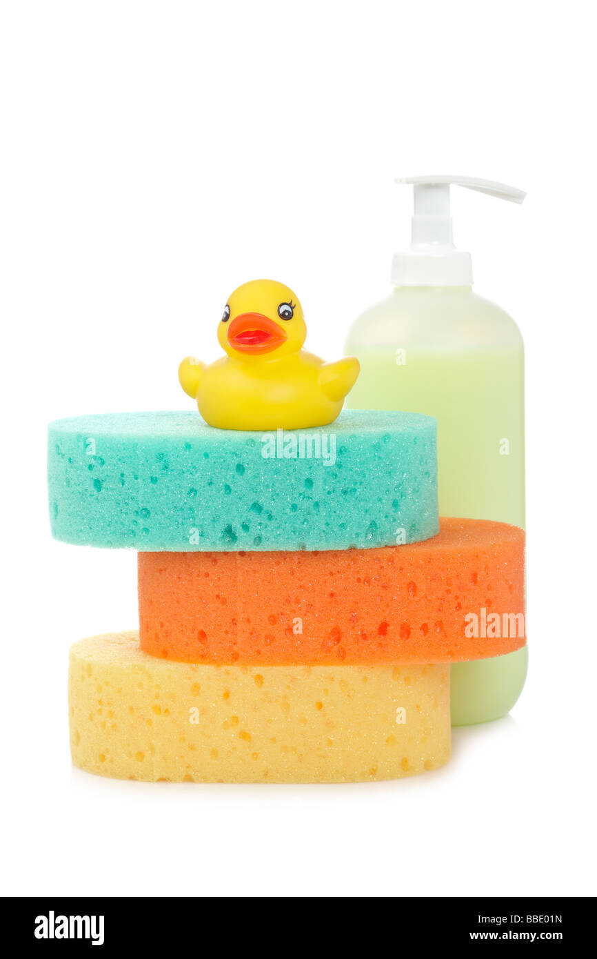 Rubber duck plastic pump soap bottle and sponges reflected on white ...