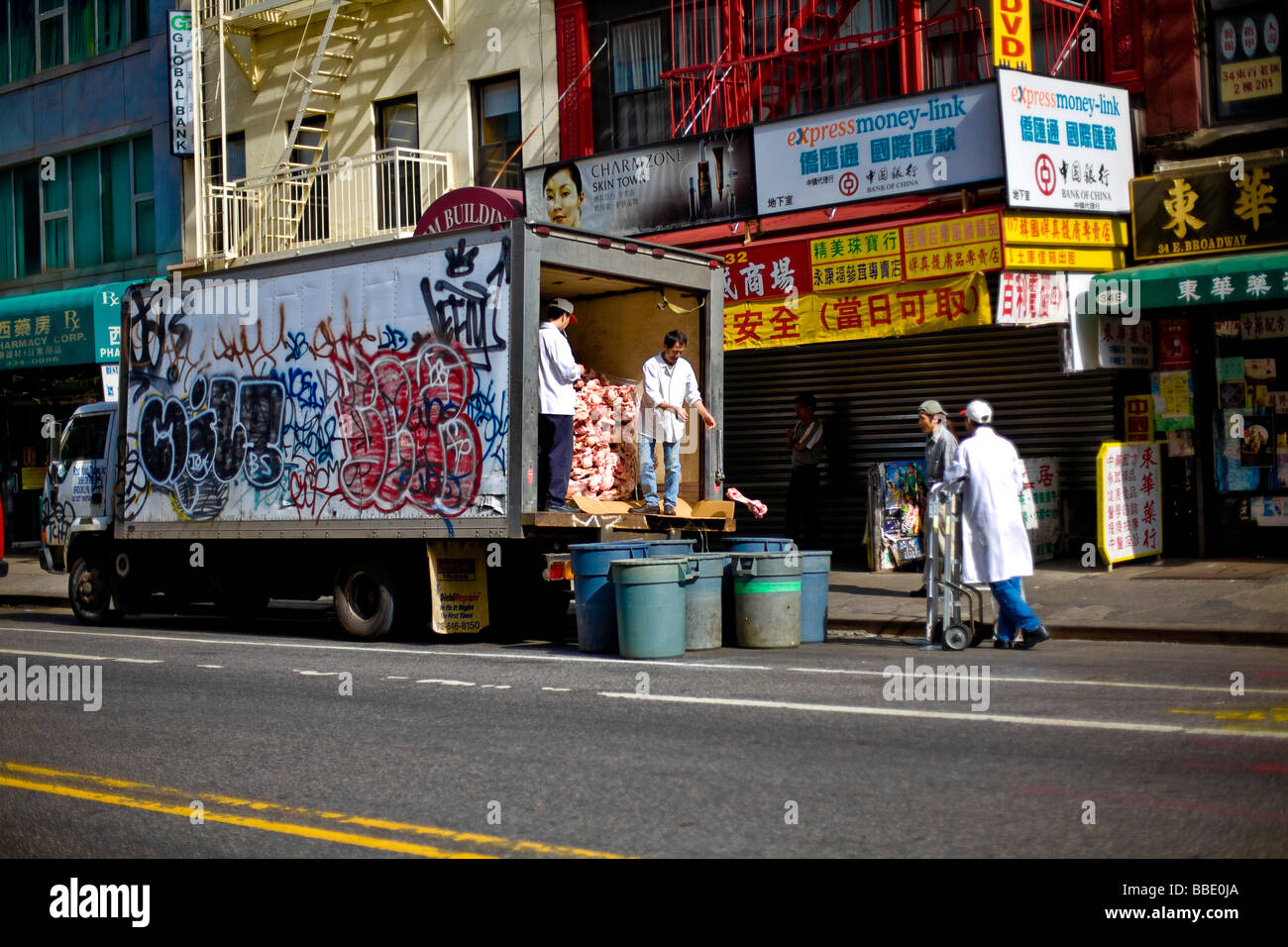 Man delivering chickens to the meat store in Chinatown of downtown ...