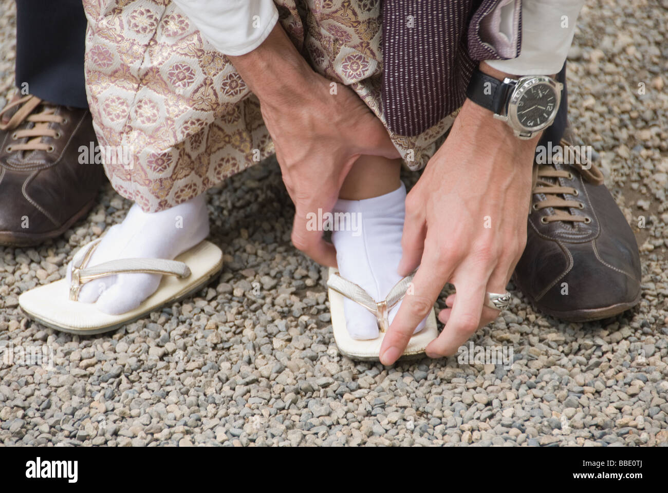 Father helping son to wear Japanese zouri Stock Photo - Alamy